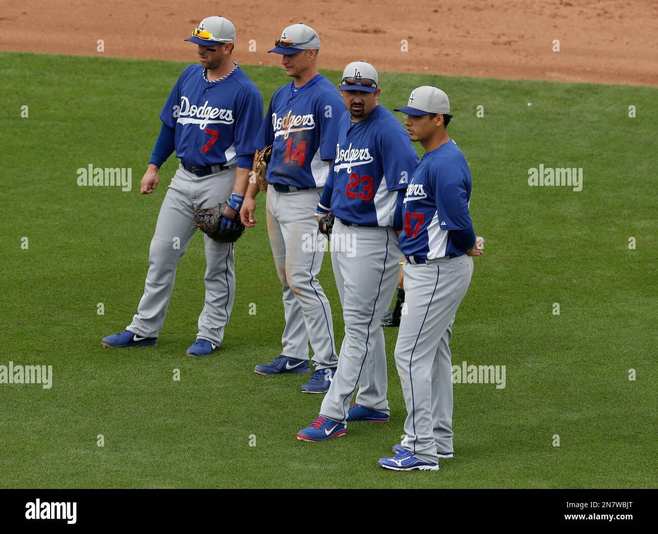 The Los Angeles Dodgers infield watch as a new pitcher comes into the ...