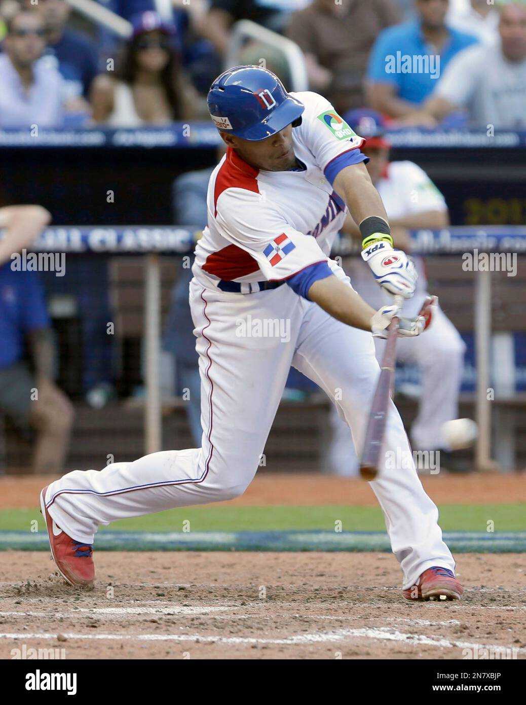 Dominican Republic's Francisco Pena hits a single against Puerto Rico ...