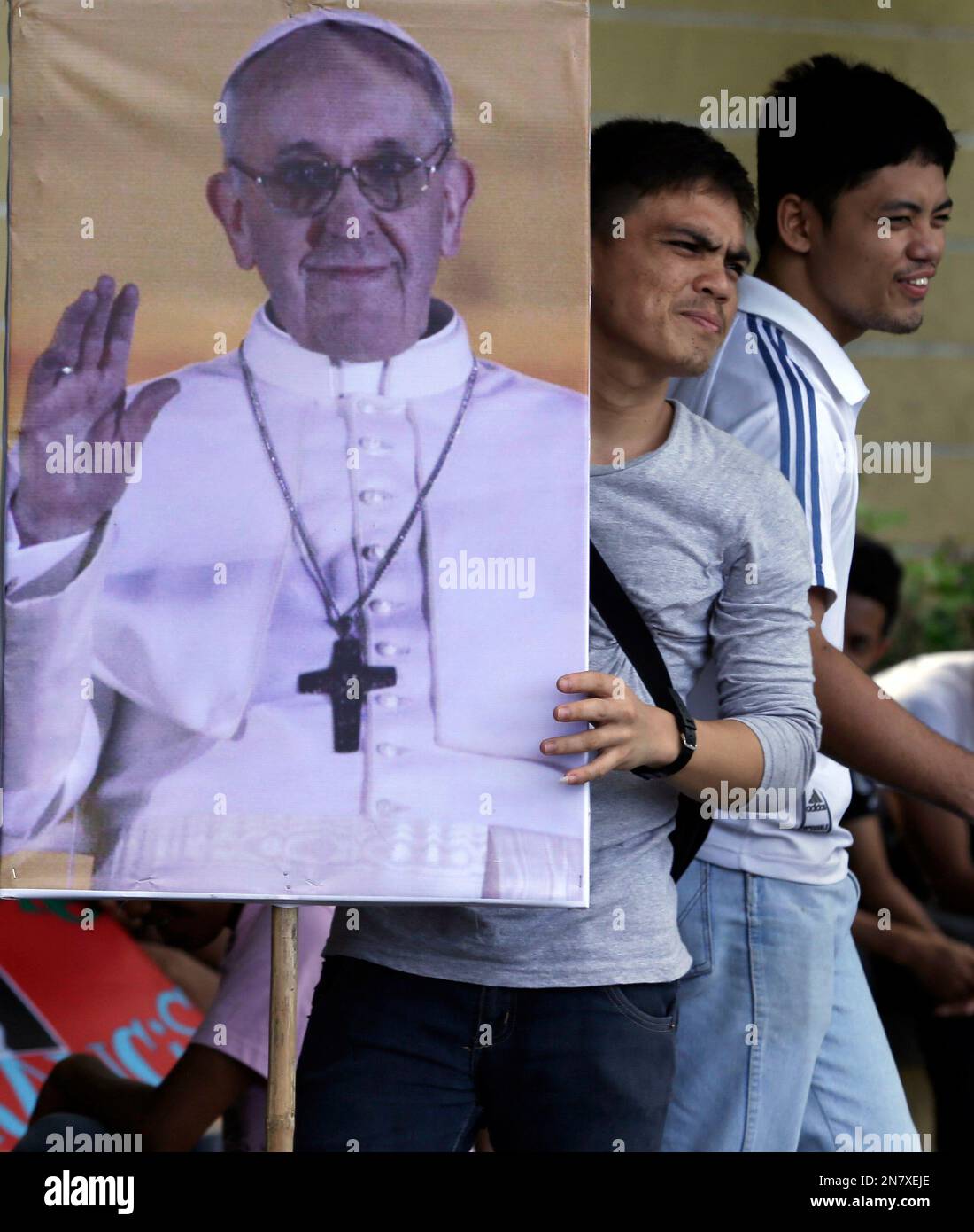 Filipino Catholic devotees display a portrait of newly-elected Pope ...