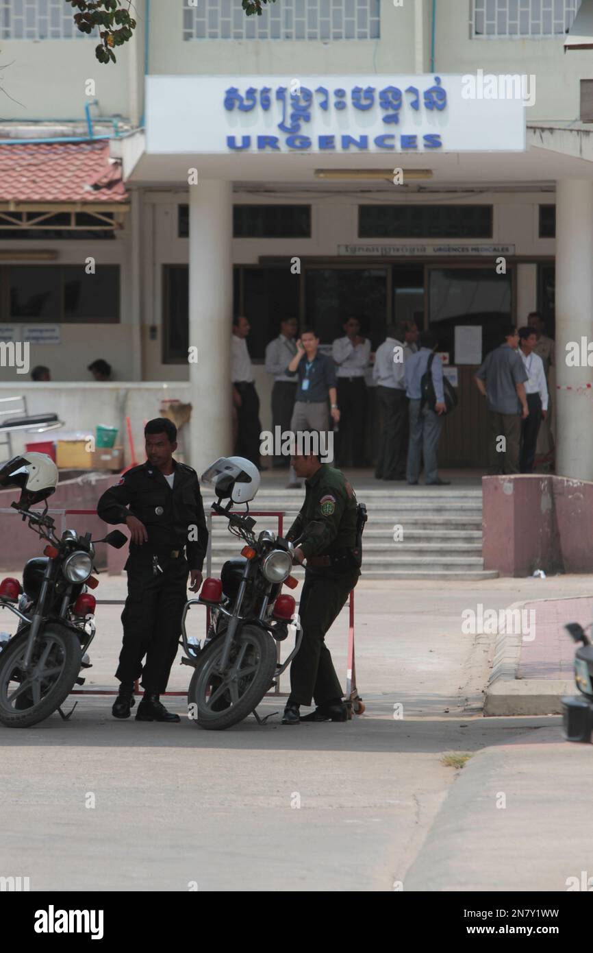 Cambodian police officers stand guard in front of the emergency room at ...