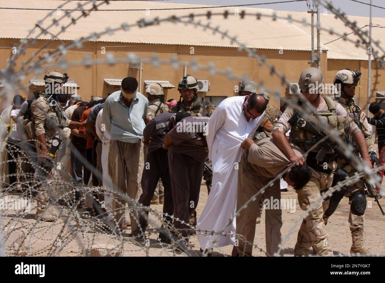 FILE - In this Friday, July 20, 2012 file photo, blindfolded and ...