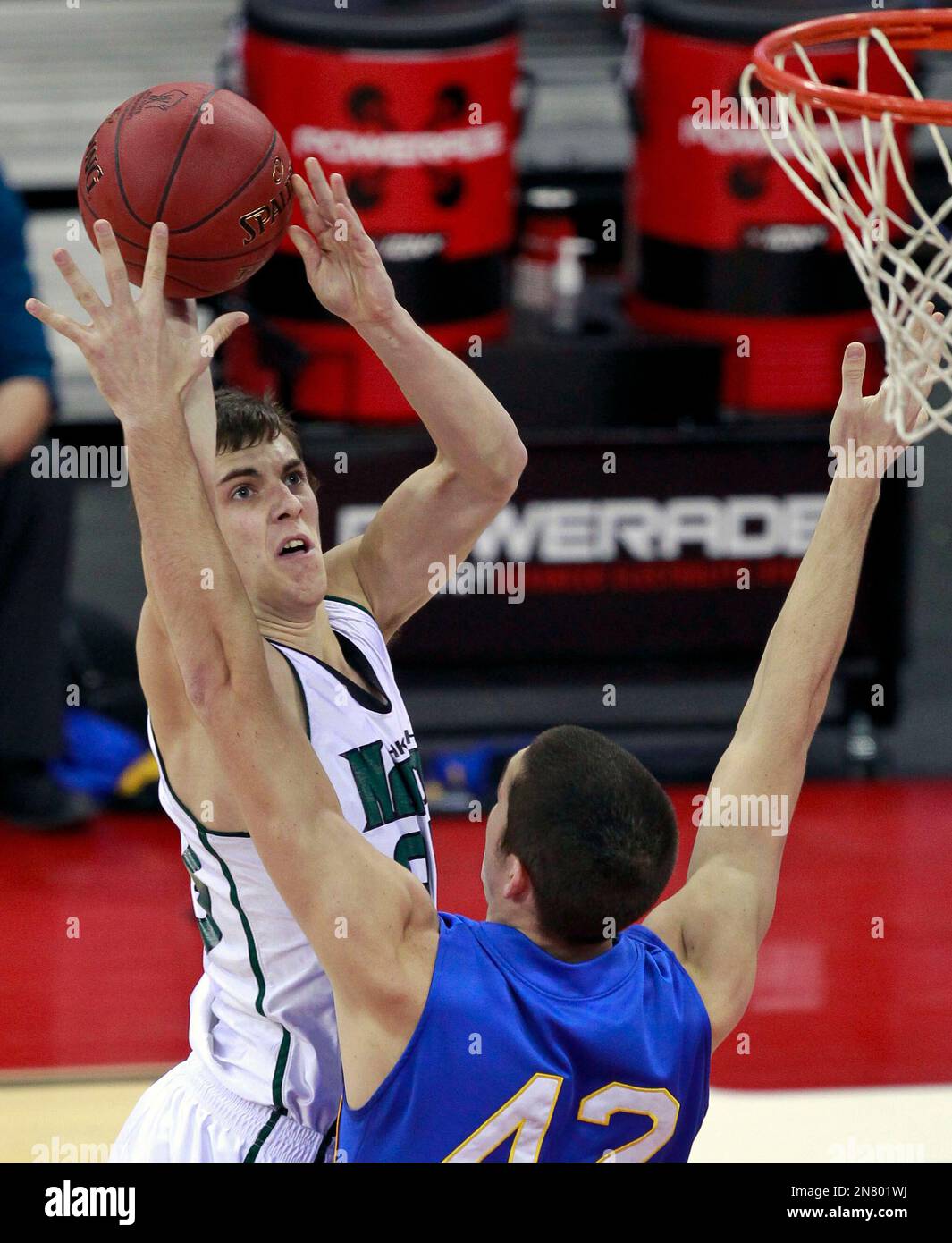 Oshkosh North's Cooper Radtke, left, shoots against Germantown's Jon ...