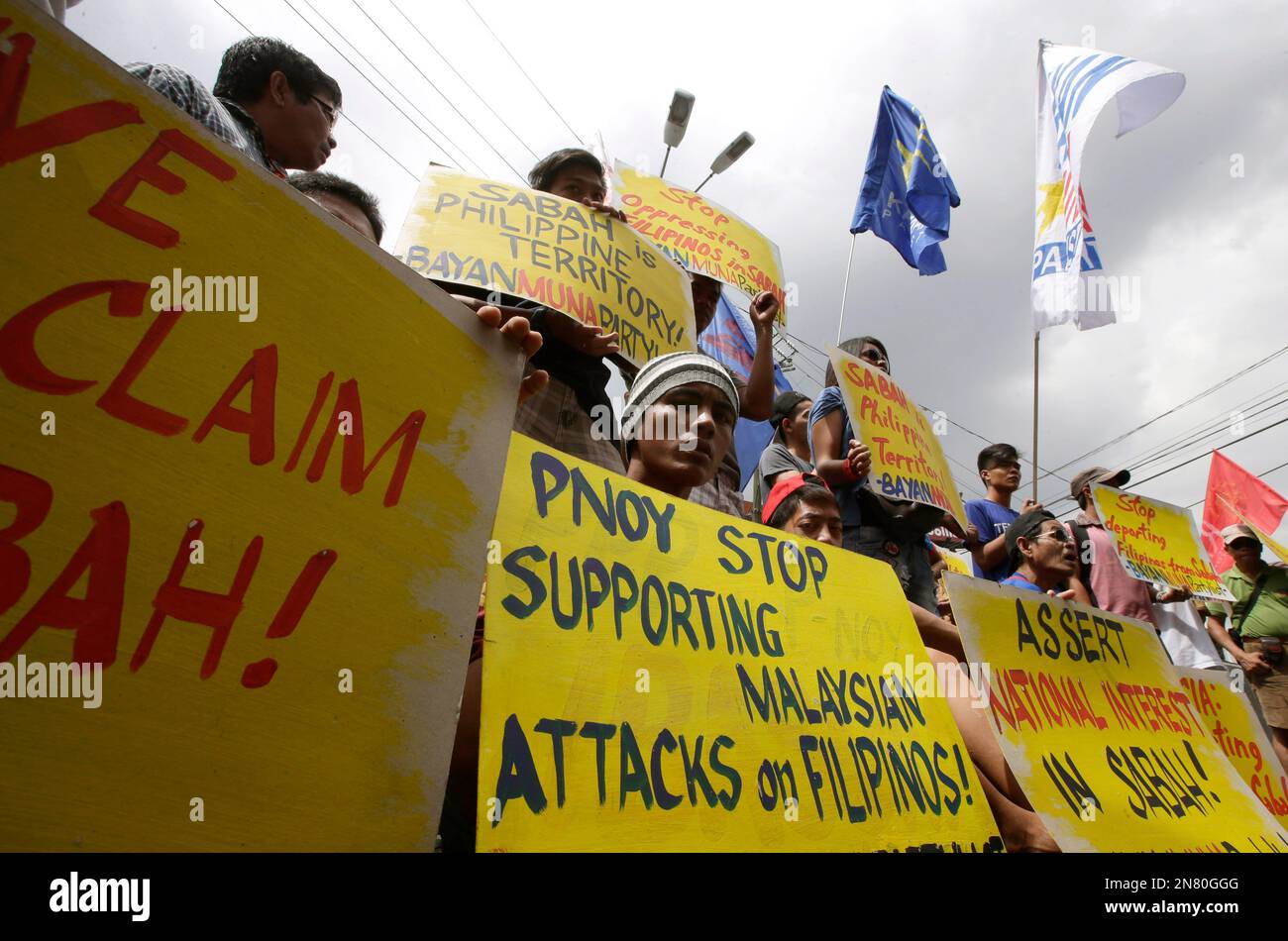 Protesters display placards during a rally near the Presidential Palace ...