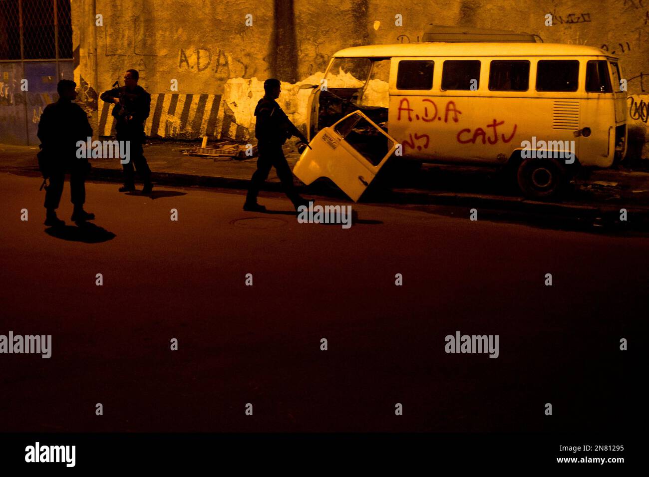 Police officers patrol the Parque Alegria slum during a conjoint ...