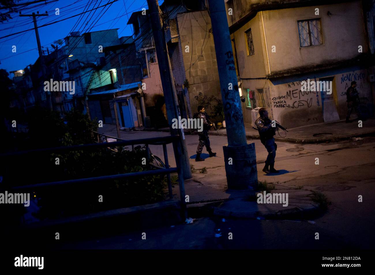 Police officers patrol the Parque Alegria slum during a conjoint ...