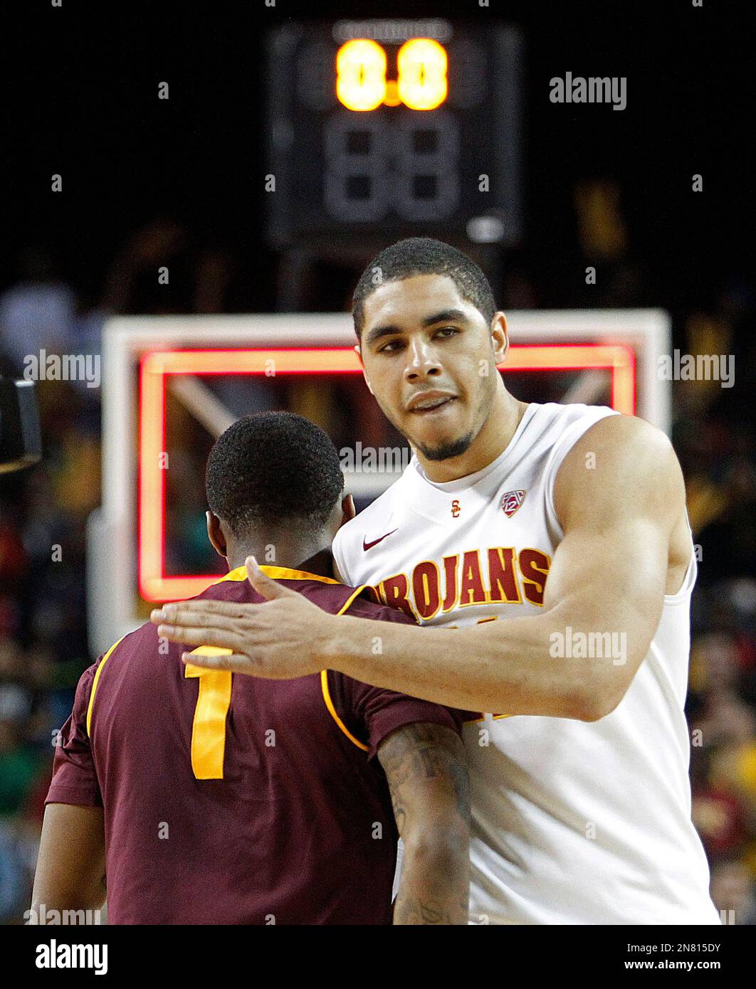 Arizona State guard Jahil Carson (1) is consoled by Southern California forward Aaron Fuller (21 ...