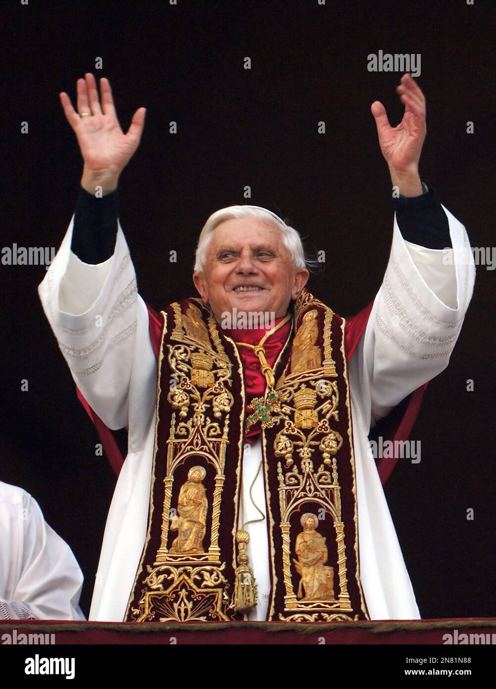 FILE - Pope Benedict XVI greets the crowd from the central balcony of ...