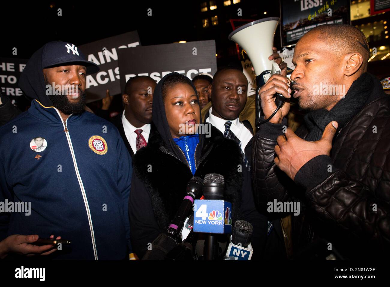 Entertainer Jamie Foxx, right, speaks alongside Tracy Martin and ...