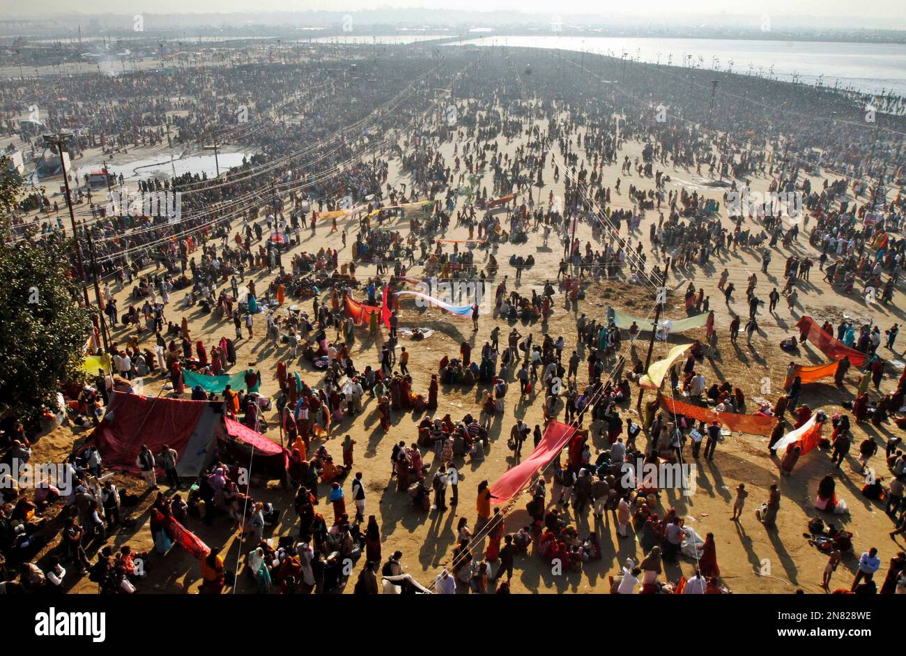 Indian devotees arrive to take holy dips at Sangam, the confluence of ...