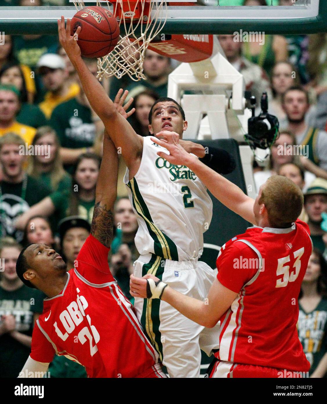 Colorado State guard Daniel Bejarano, center, tries to make a reverse ...