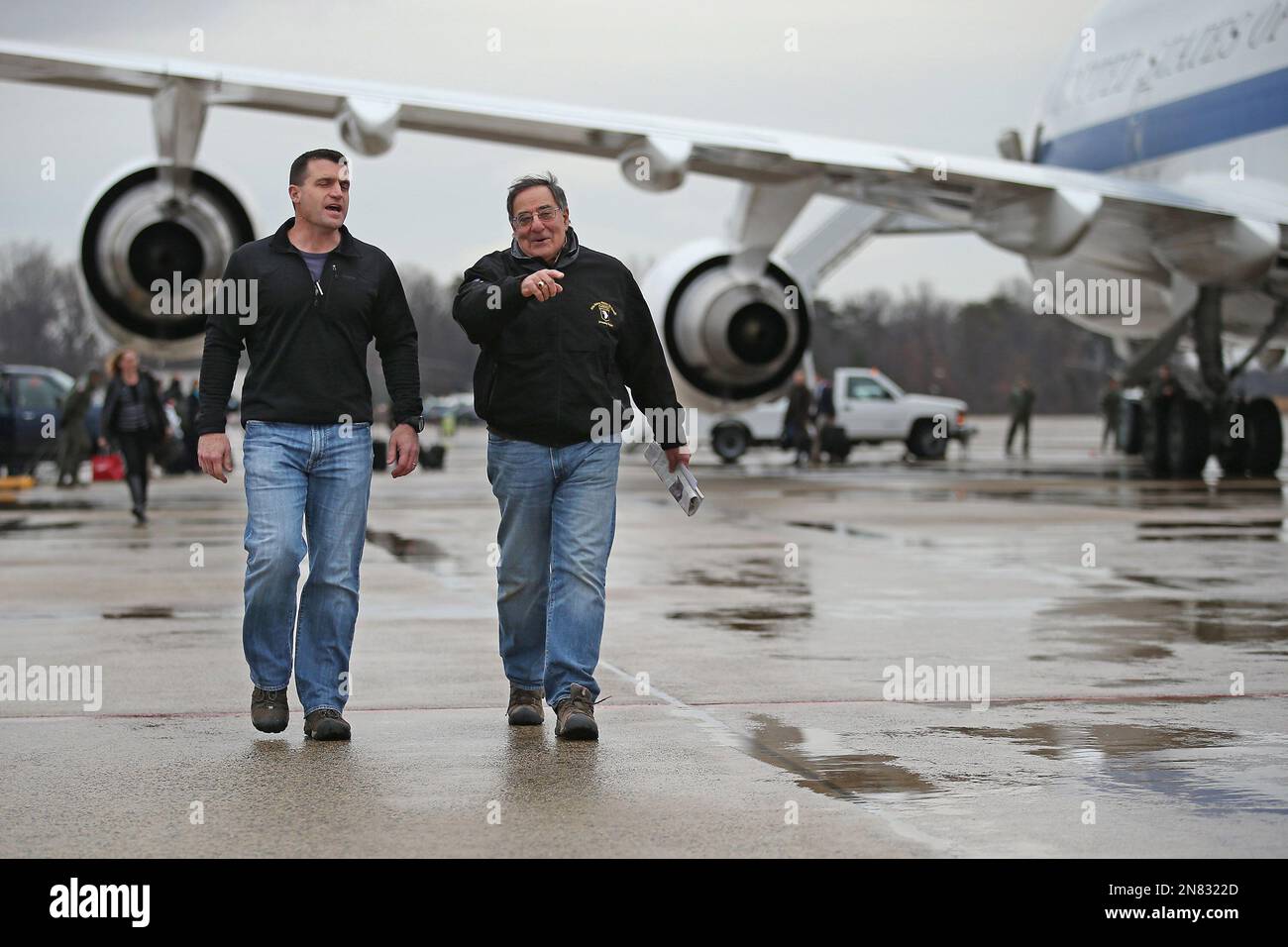 U.S. Defense Secretary Leon Panetta (R) and his military assistant Navy ...