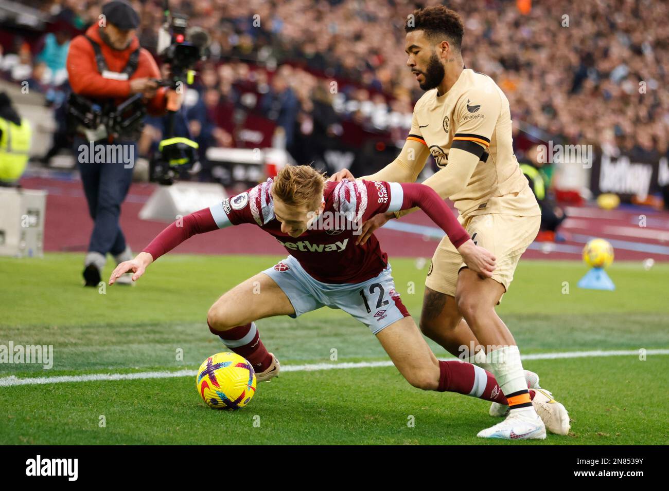 Chelsea's Reece James, right, challenges for the ball with West Ham's ...