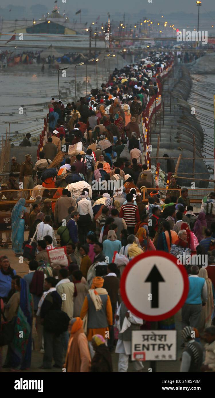 Indian devotees arrive for a holy dip at Sangam, the confluence of the ...
