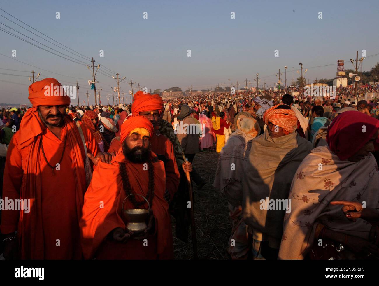Indian holy men sing and ask for alms at Sangam, the confluence of the ...