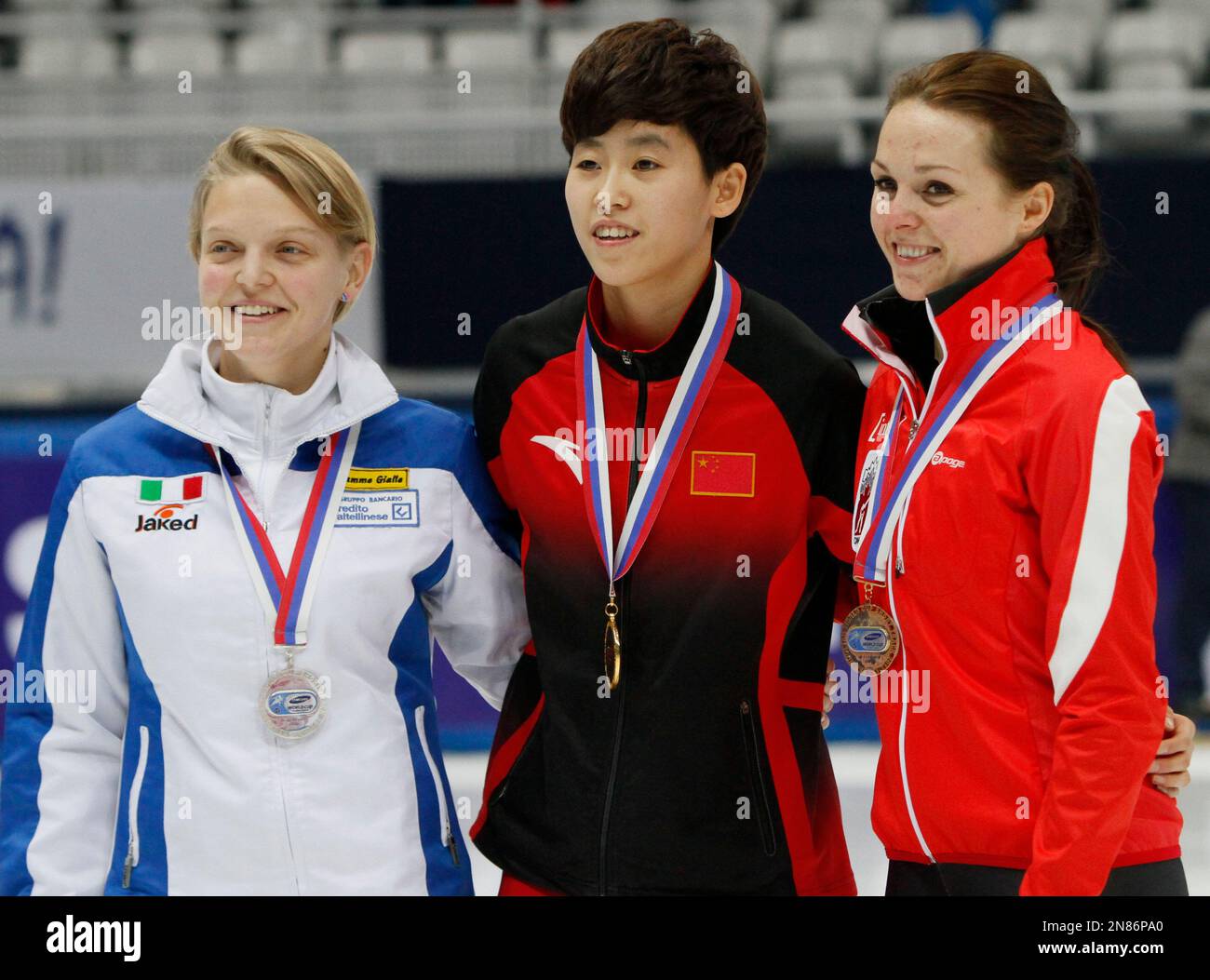 After being presented with their medals, from left, Italy's second ...