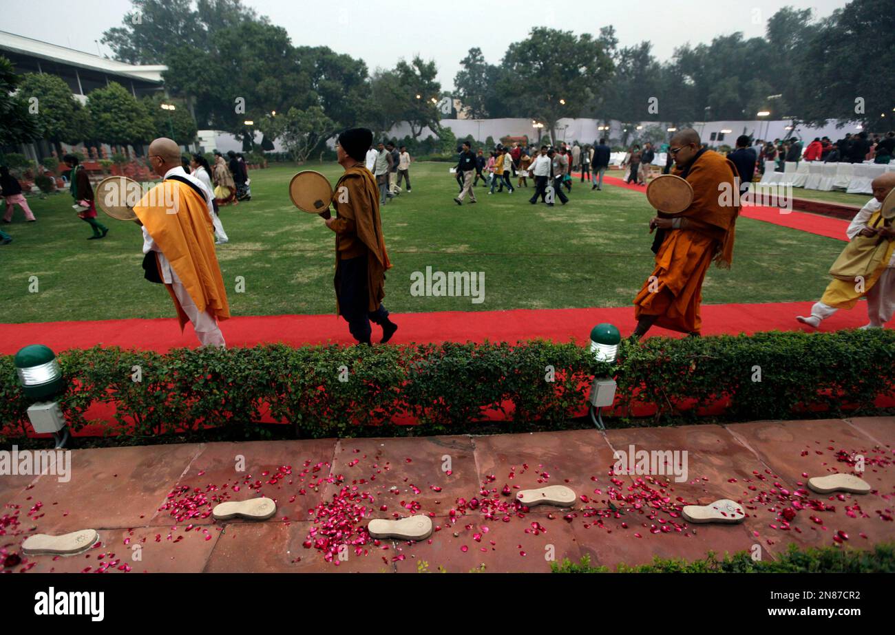 Japanese Buddhist monks walk past footprints that mark the last steps ...