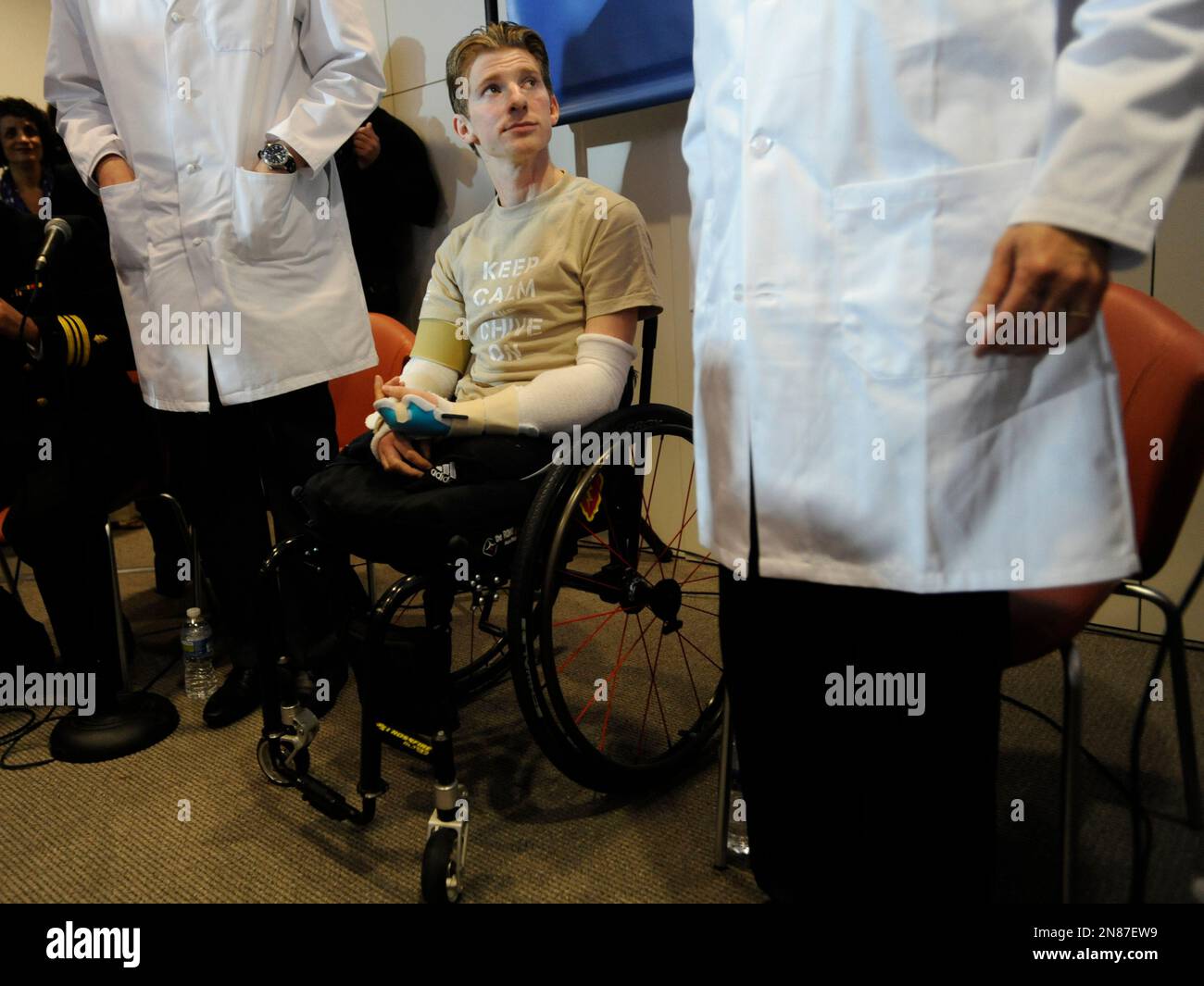 Retired Infantryman Brendan M. Marrocco listens during a news ...