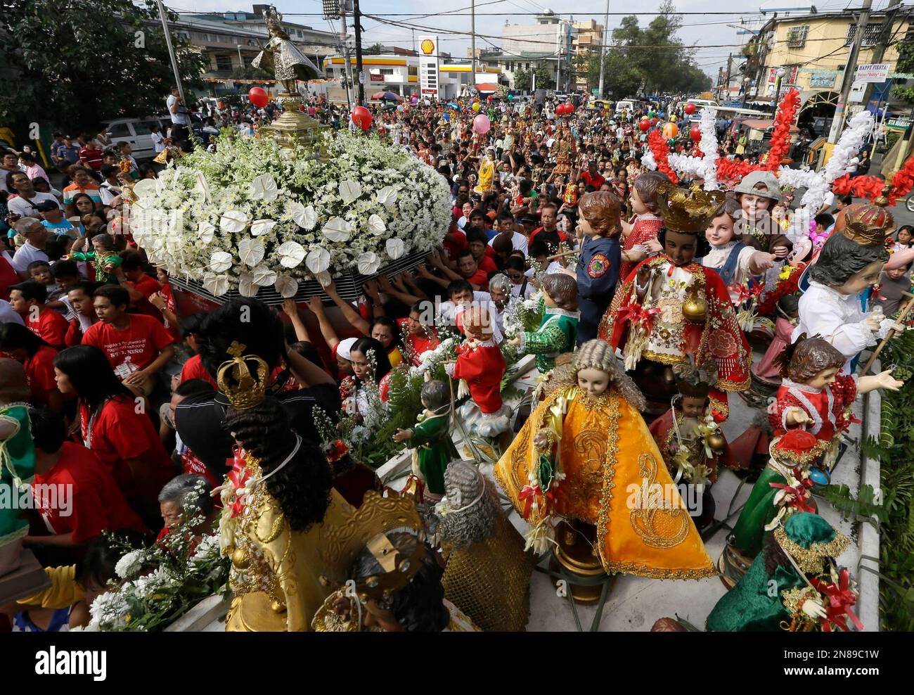 Hundreds of Roman Catholic devotees join the procession with images of ...