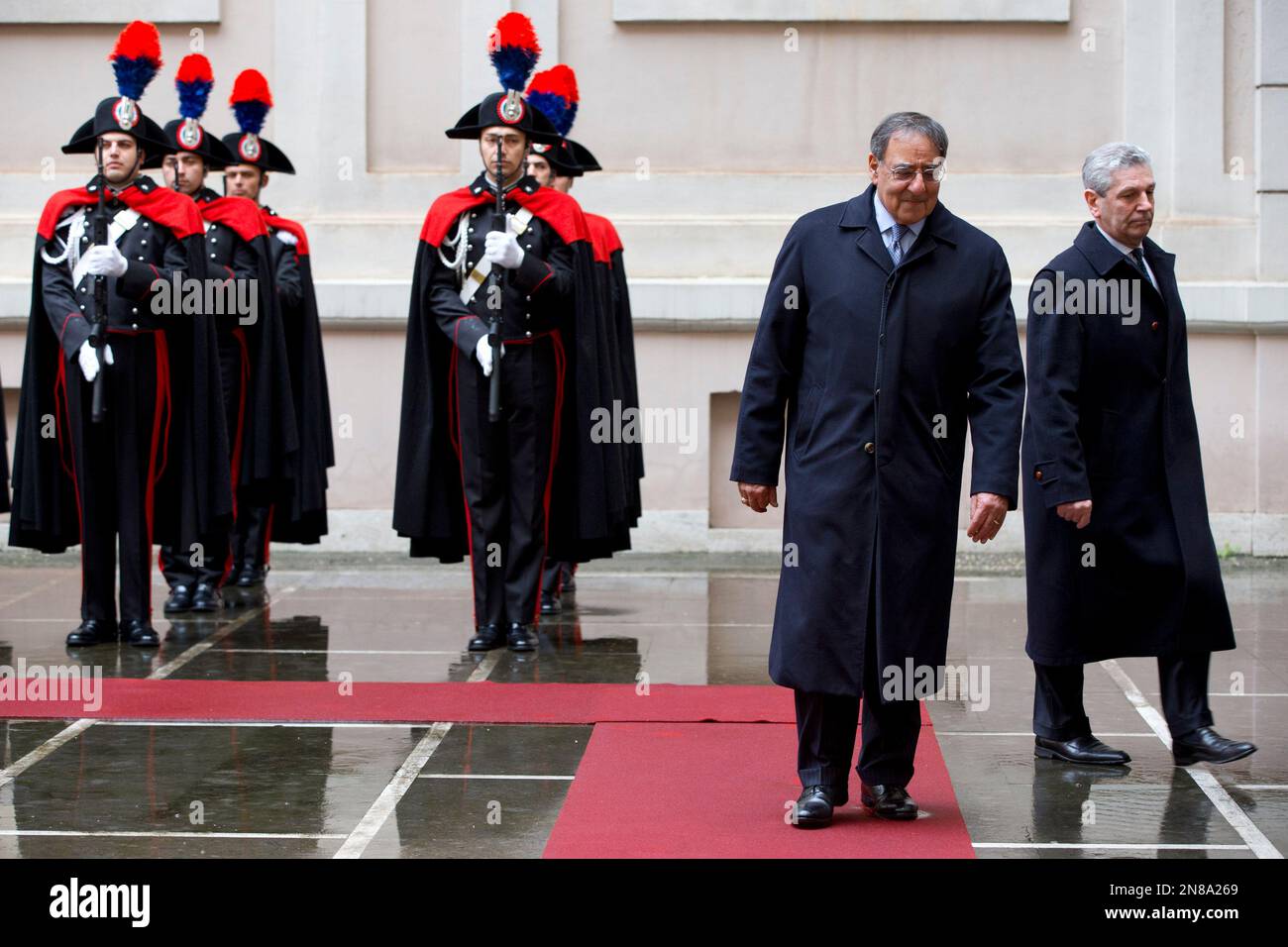 Defense Secretary Leon Panetta walks with Italian Defense Minister ...