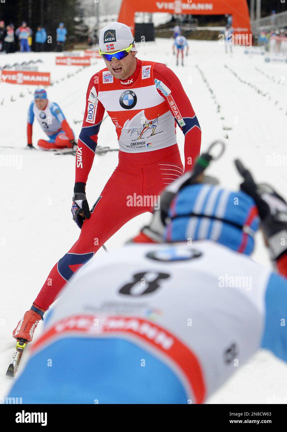 3rd placed Petter Northug of Norway, center, skis in the finish area ...