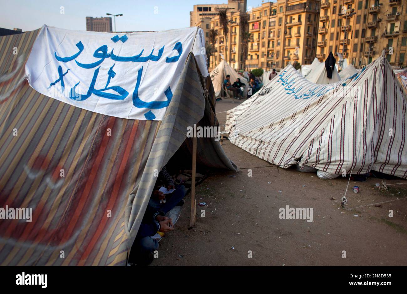 Egyptian protesters opposing president Mohammed Morsi sit by tents, one ...