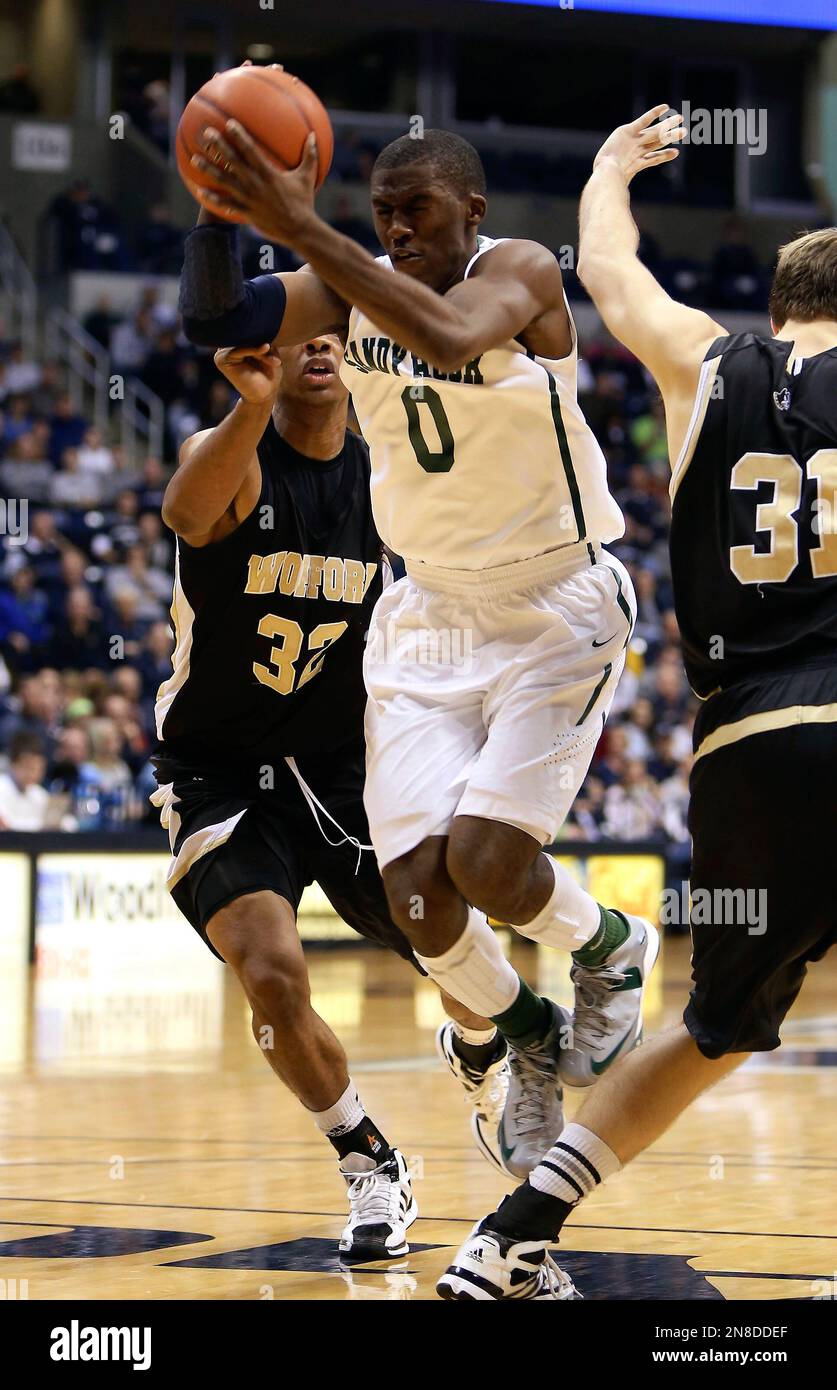Xavier guard Semaj Christon, center, drives to the basket past Wofford ...