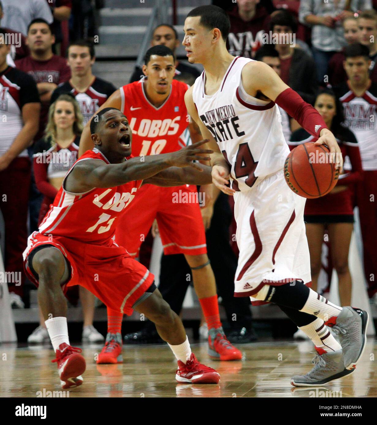 New Mexico's Jamal Fenton, left, reaches to steal the ball from New ...