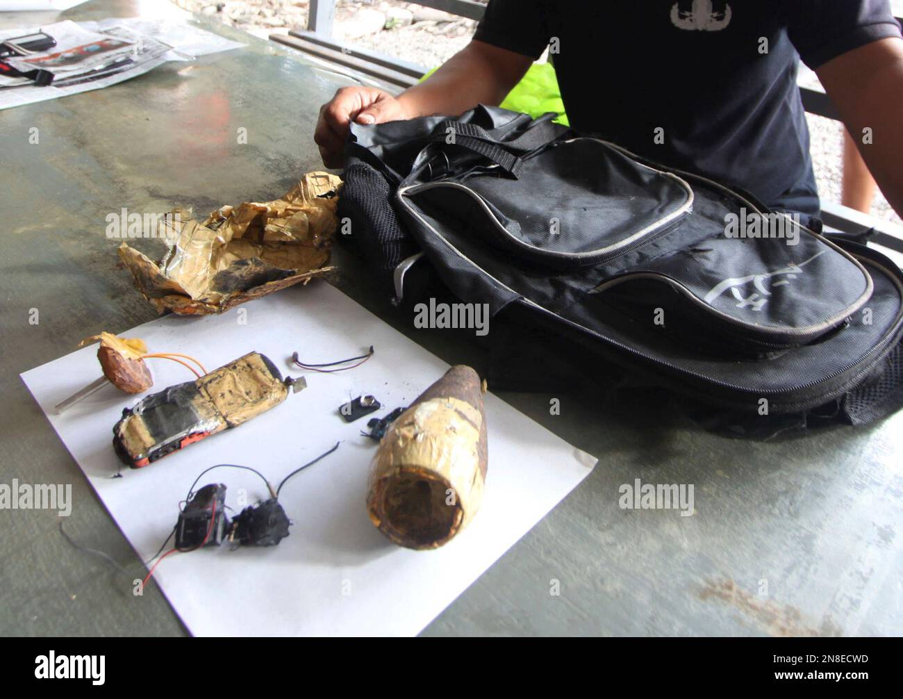 A Philippine National Police investigator reveals an improvised ...