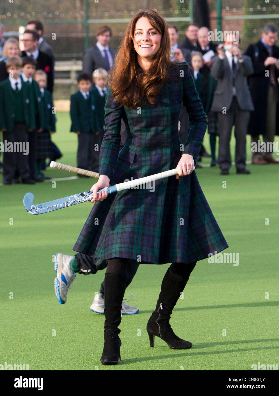 Kate, the Duchess of Cambridge, plays hockey during her visit to St ...
