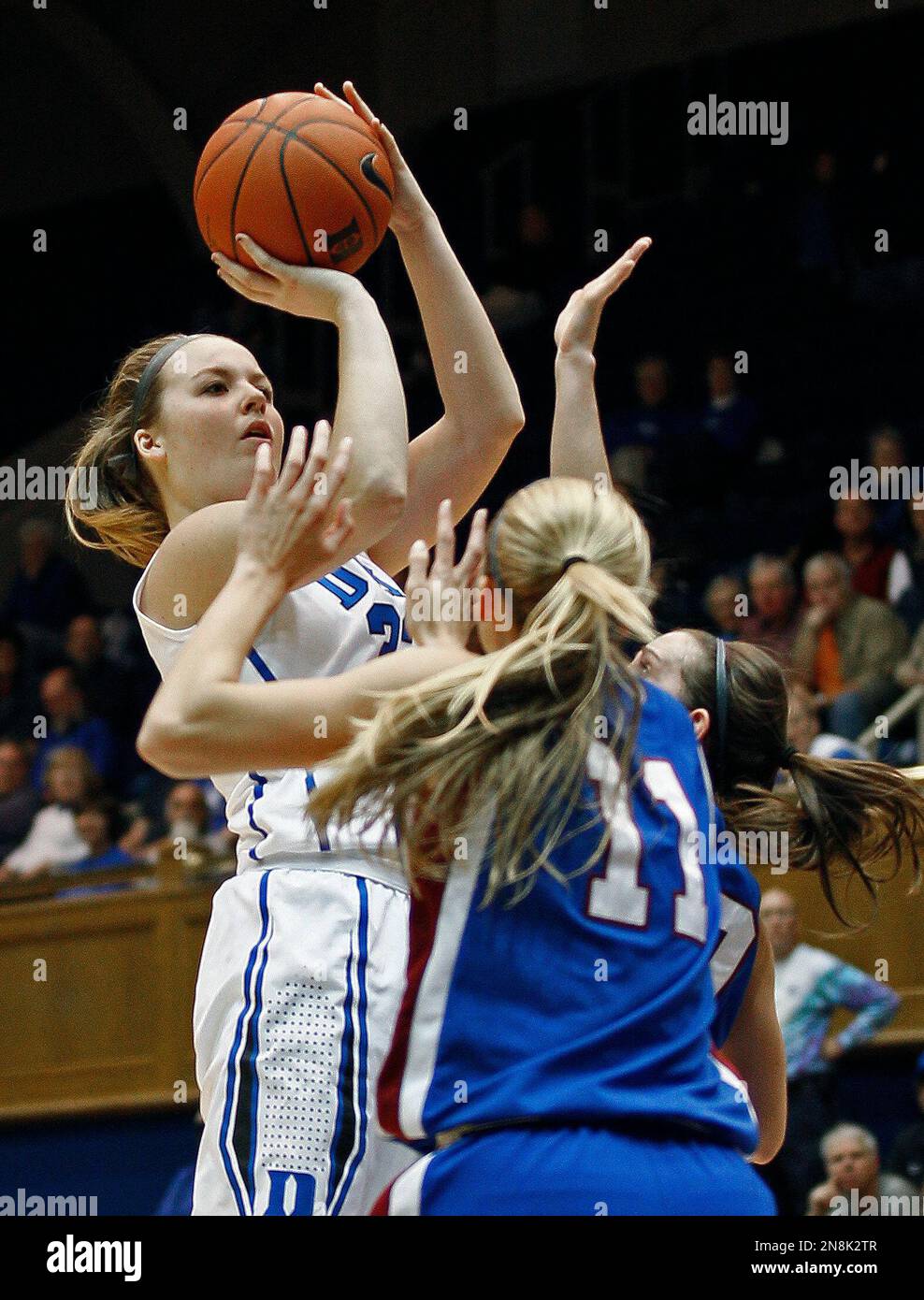 Duke's Tricia Liston, left, shoots as Presbyterian's Chelsea Parker (11 ...