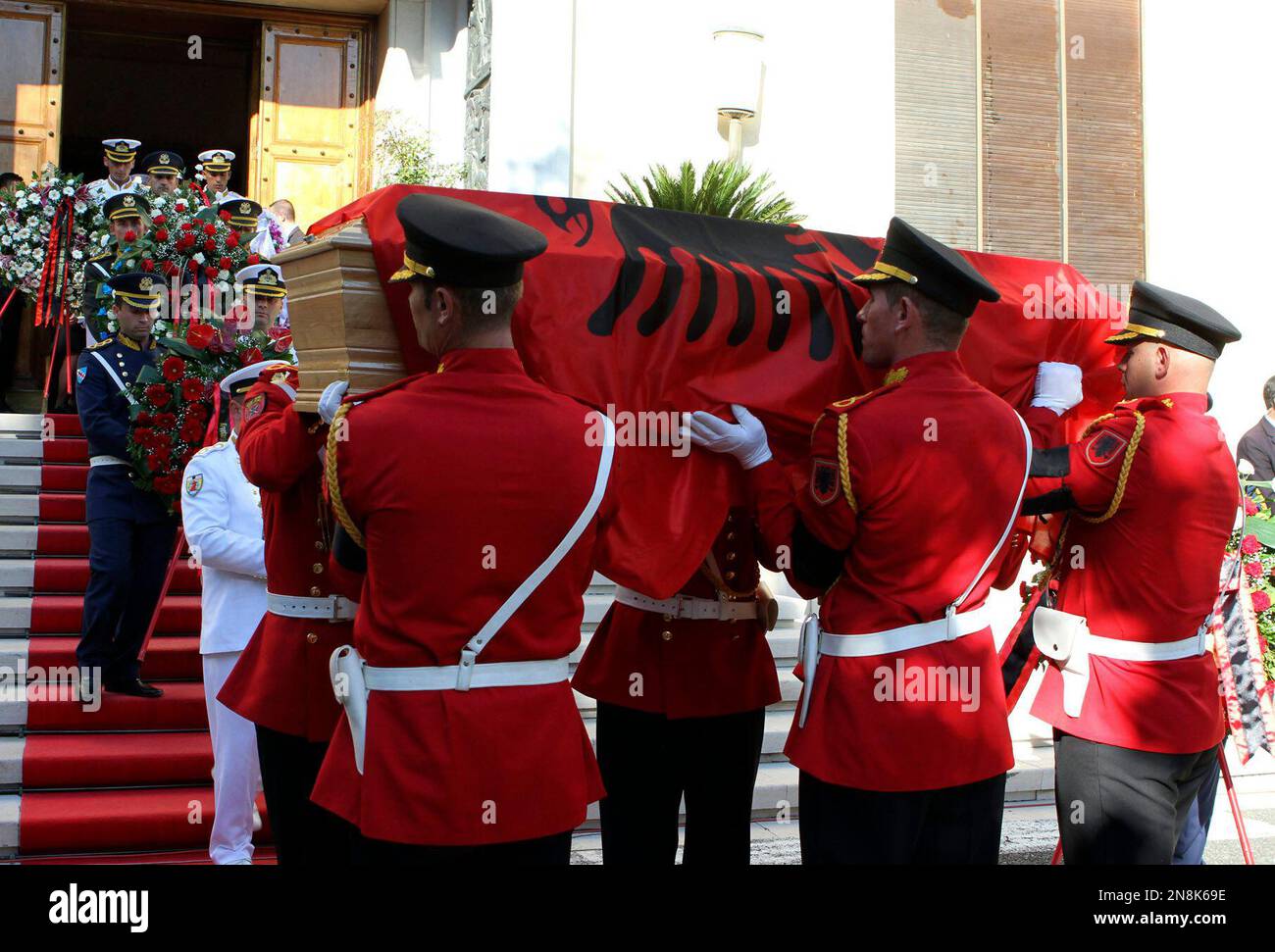 An Albanian honour guards carry the coffin of Albania's only post ...