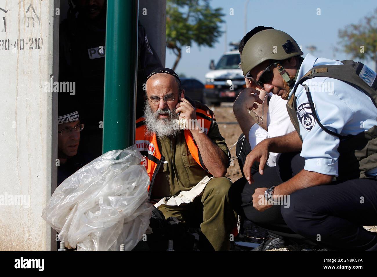 Israeli Security Personnel Take Cover In Kiryat Malachi Southern