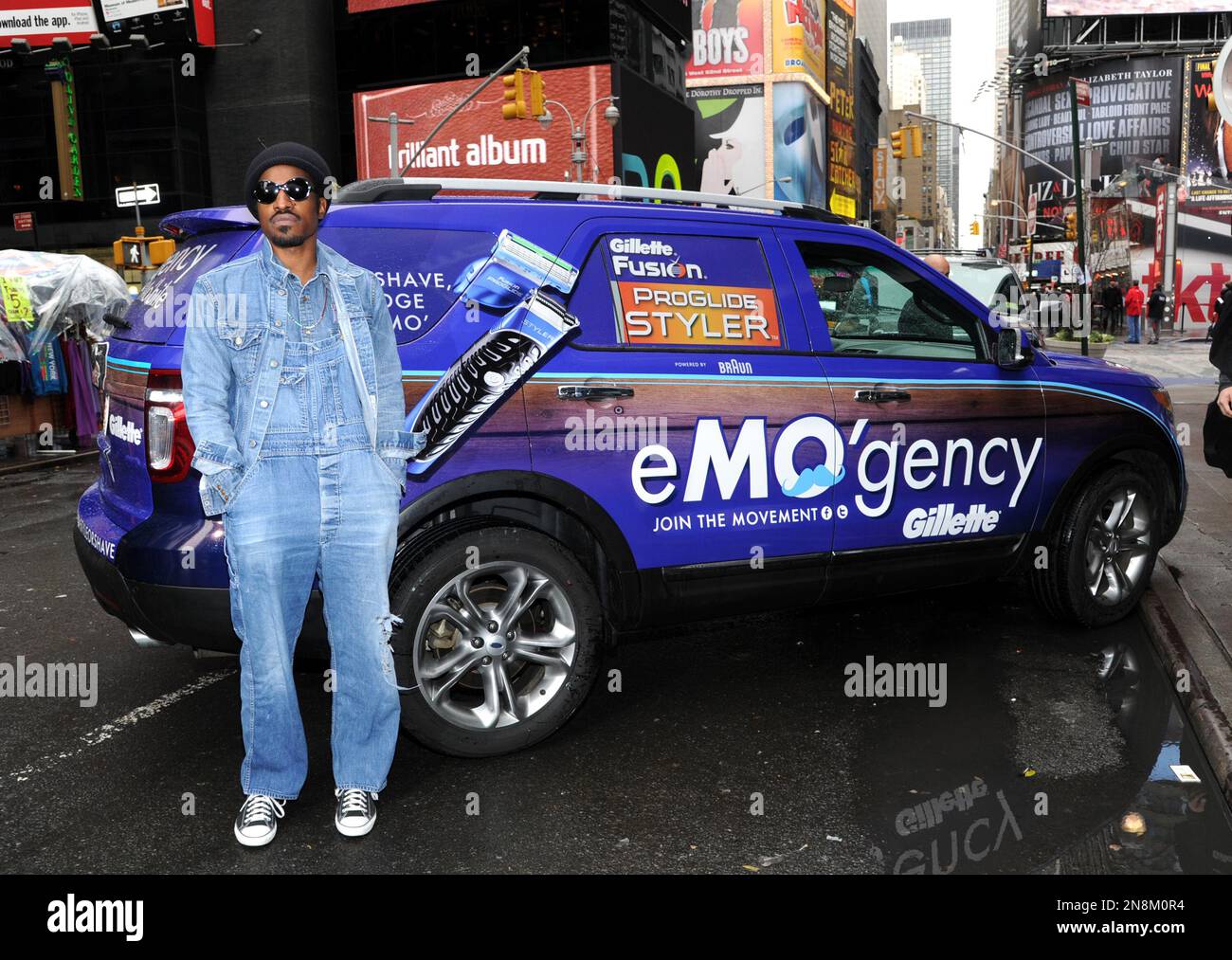 Andre 3000 Benjamin poses with the eMO’gency Tour vehicle and Gillette ...