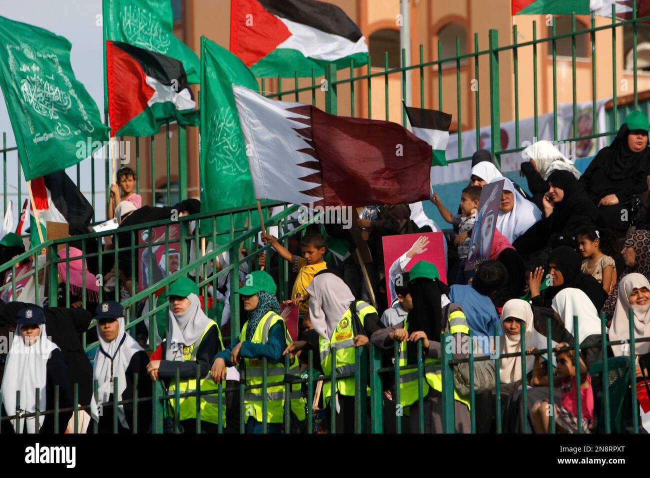 Palestinian Hamas police women stand in front of Hamas supporters while ...