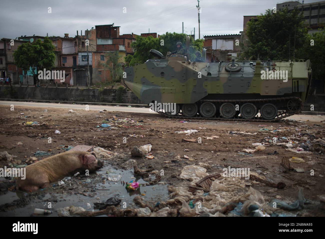 An armored navy vehicle patrols the Maguinhos slum during an operation ...