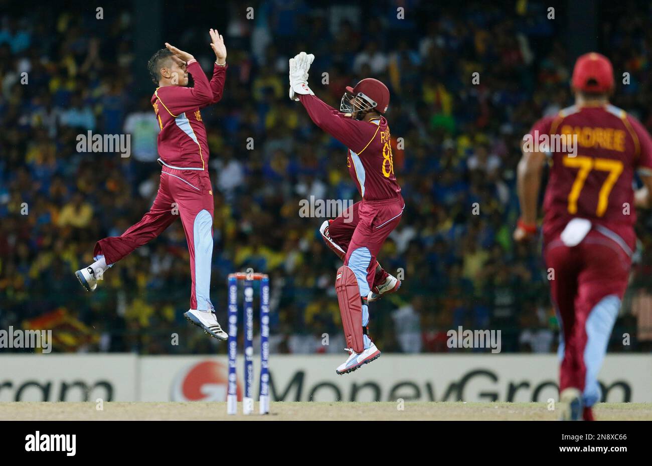 West Indies's bowler Sunil Narine, left, celebrates the dismissal of ...