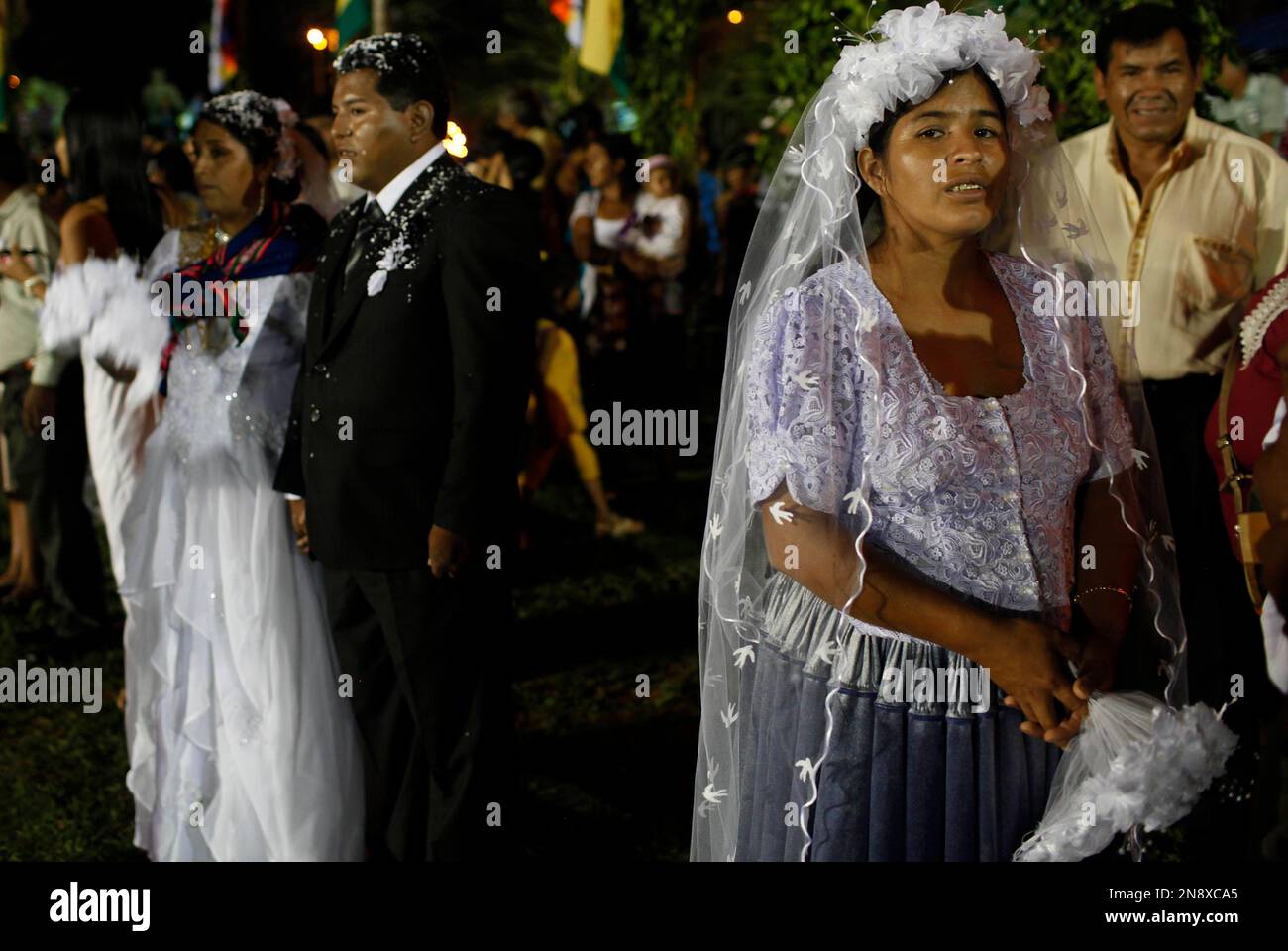 Couples participate in a collective wedding ceremony in Cobija, Bolivia ...