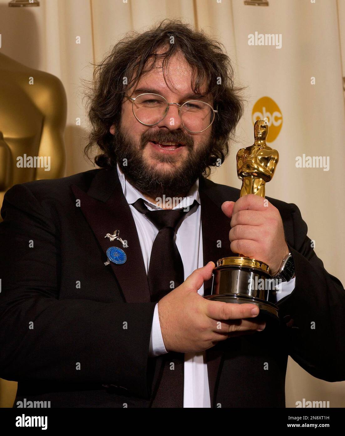 FILE - In this Feb. 29, 2004 file photo, director Peter Jackson holds ...