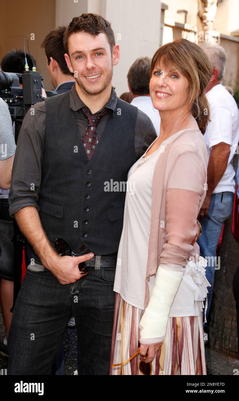 Sean Harmon, son of actor Mark Harmon, left, and Pam Dawber attend a ...