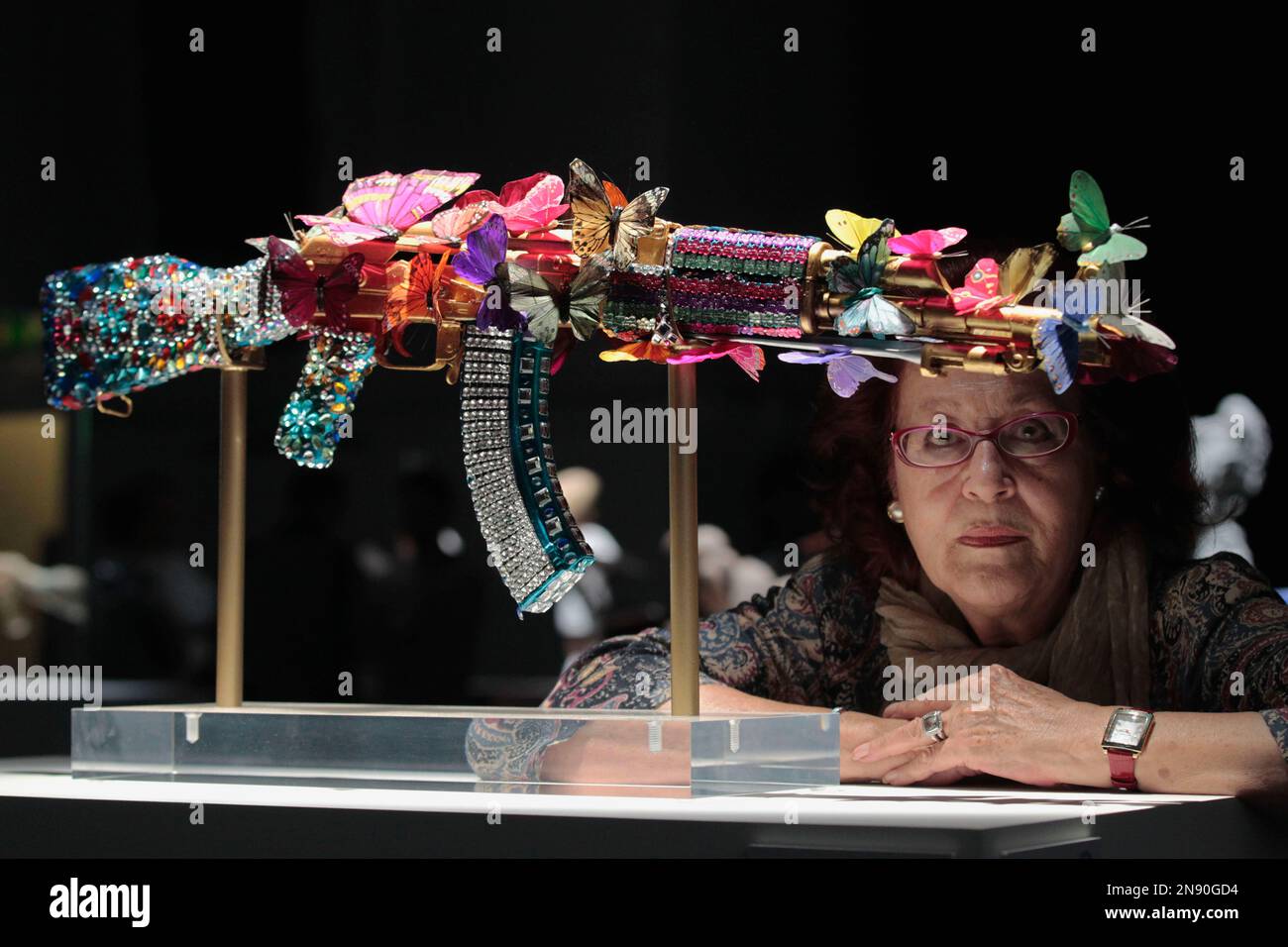 Gaza-born Palestinian artist Laila Shawa poses by her interpretation of ...