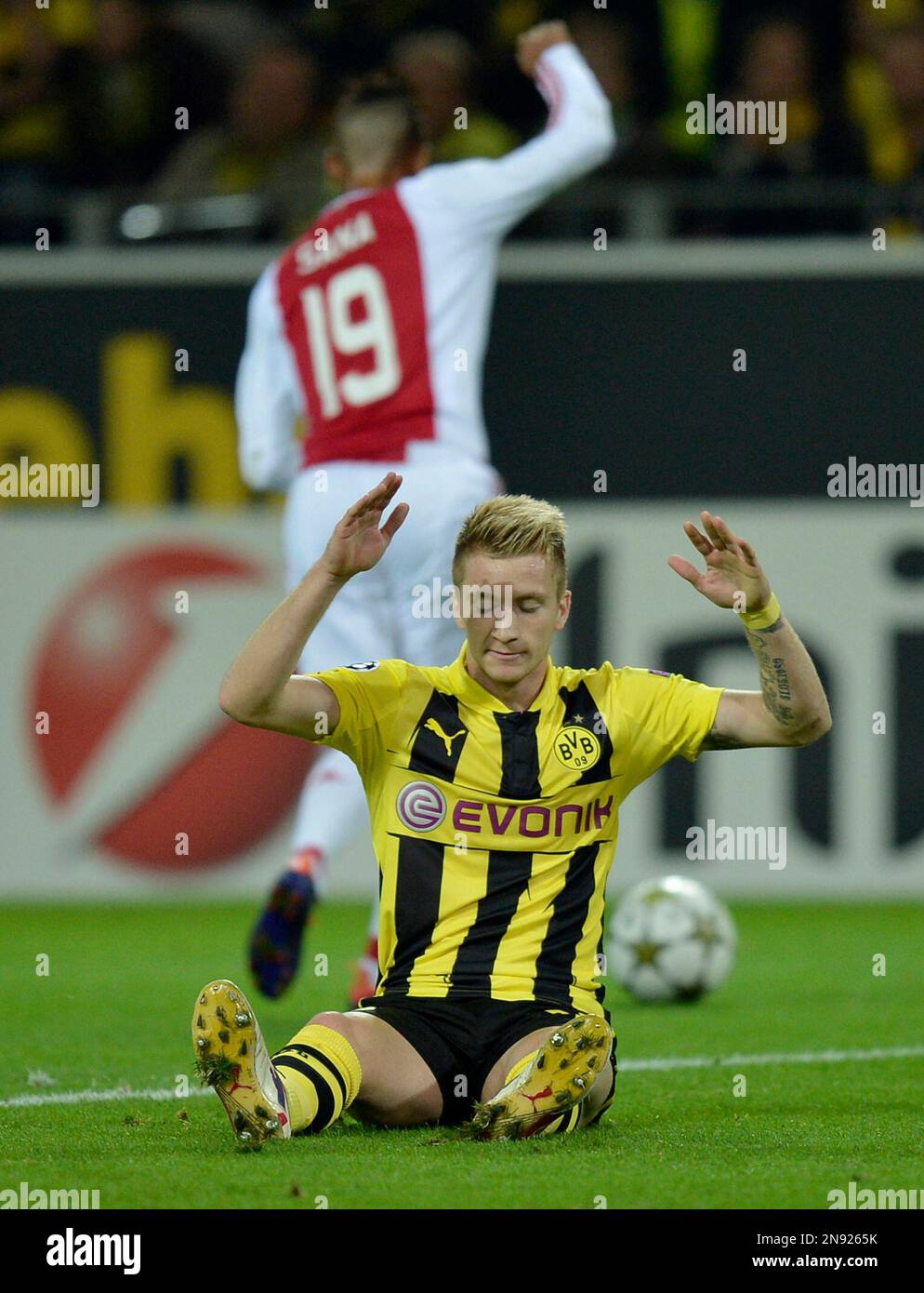 Dortmund's Marco Reus reacts on the ground during the Champions League ...