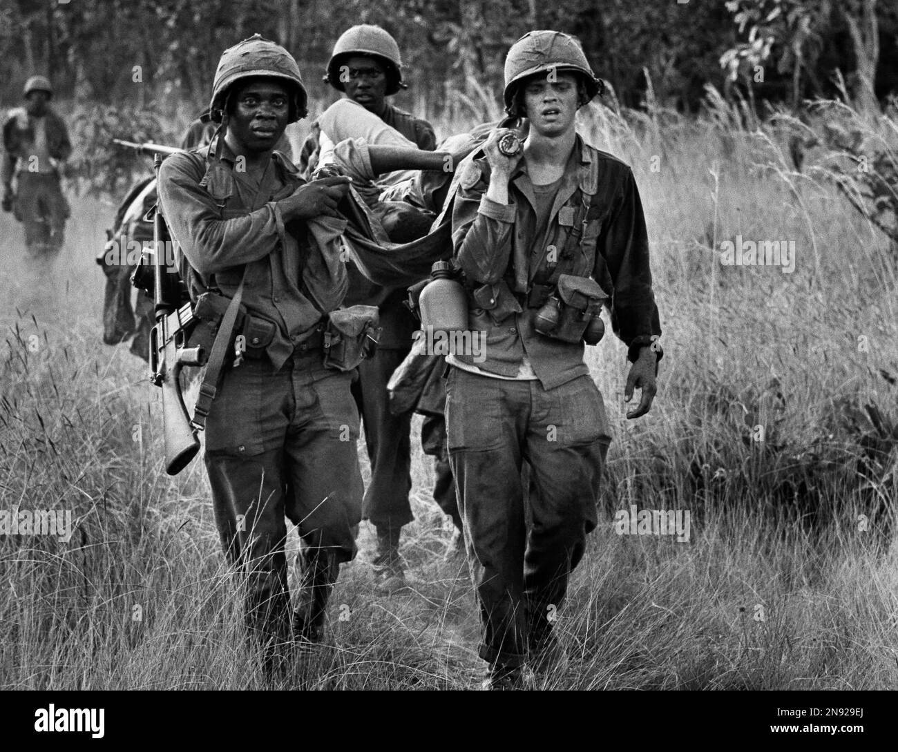 U.S. cavalrymen carry a fellow soldier to an evacuation zone after he ...