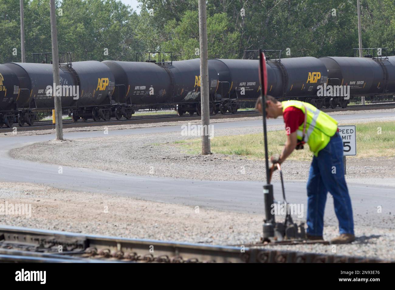 In this Aug. 8, 2012 photo, a worker is seen as DOT-111 and AAR-211 ...