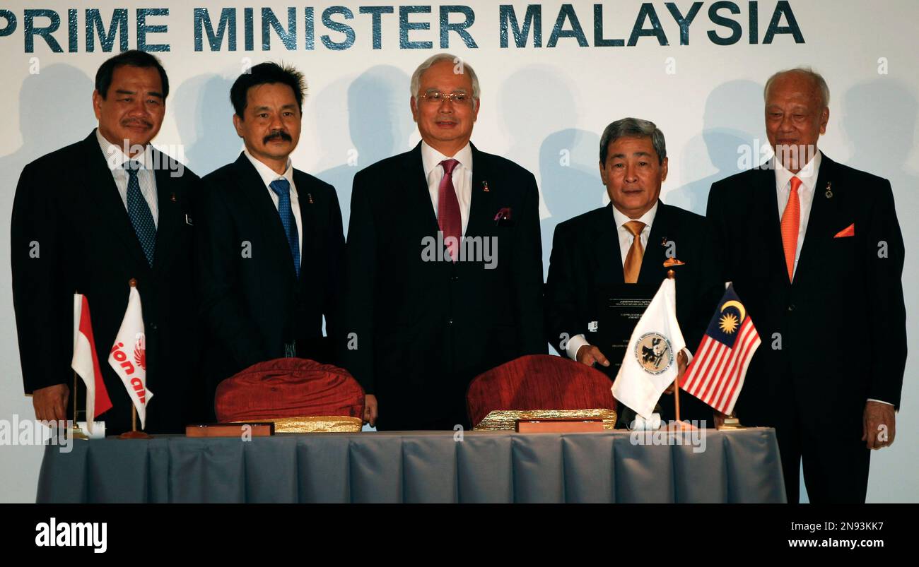From left to right, Malaysian Transport Minister Kong Cho Har ...