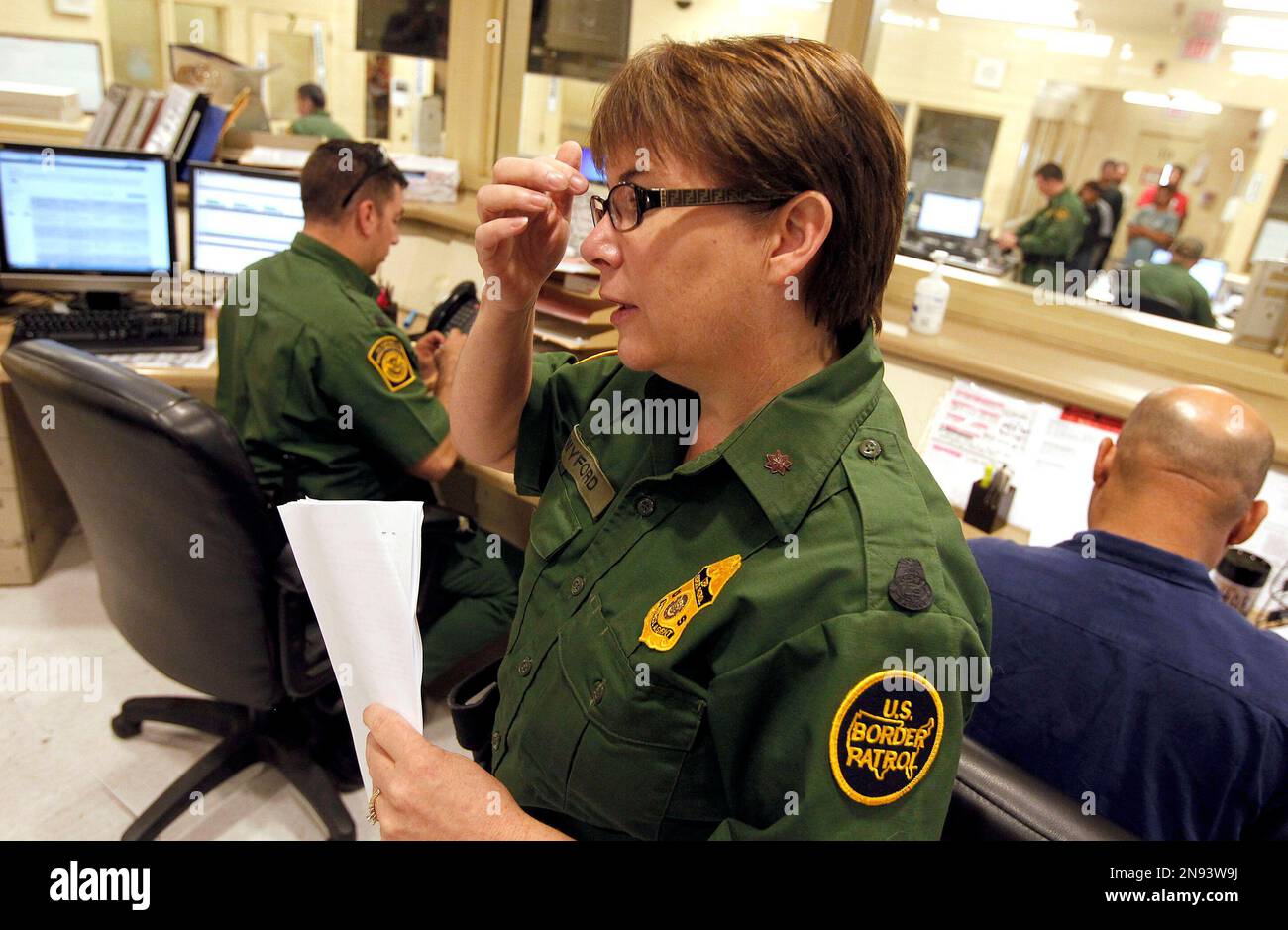 U.S. Border Patrol Tucson Sector Branch Chief Donna Twyford examines an ...