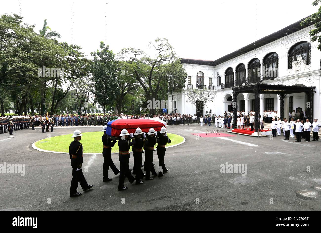 Presidential guards carry the flag-draped coffin of the late Interior ...