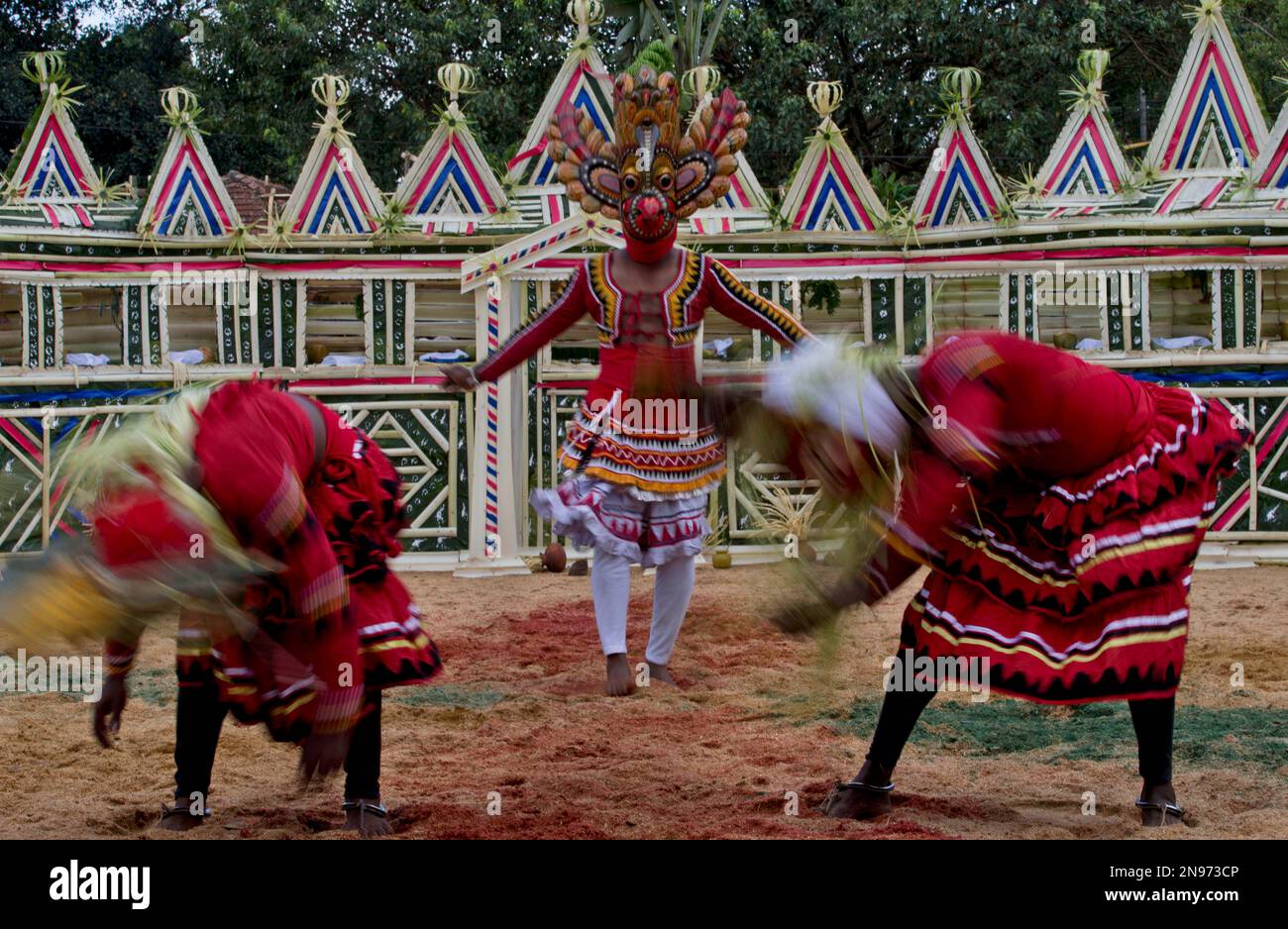 Sri Lankan prisoners, left and right perform a mask dance with a prison ...