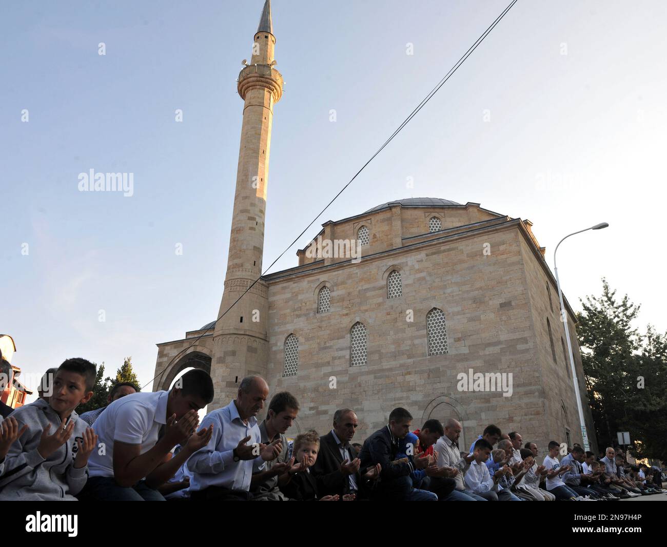 Kosovo Muslims pray in front of the Grand Mosque in Kosovo's capital Pristina Sunday, Aug. 19 ...