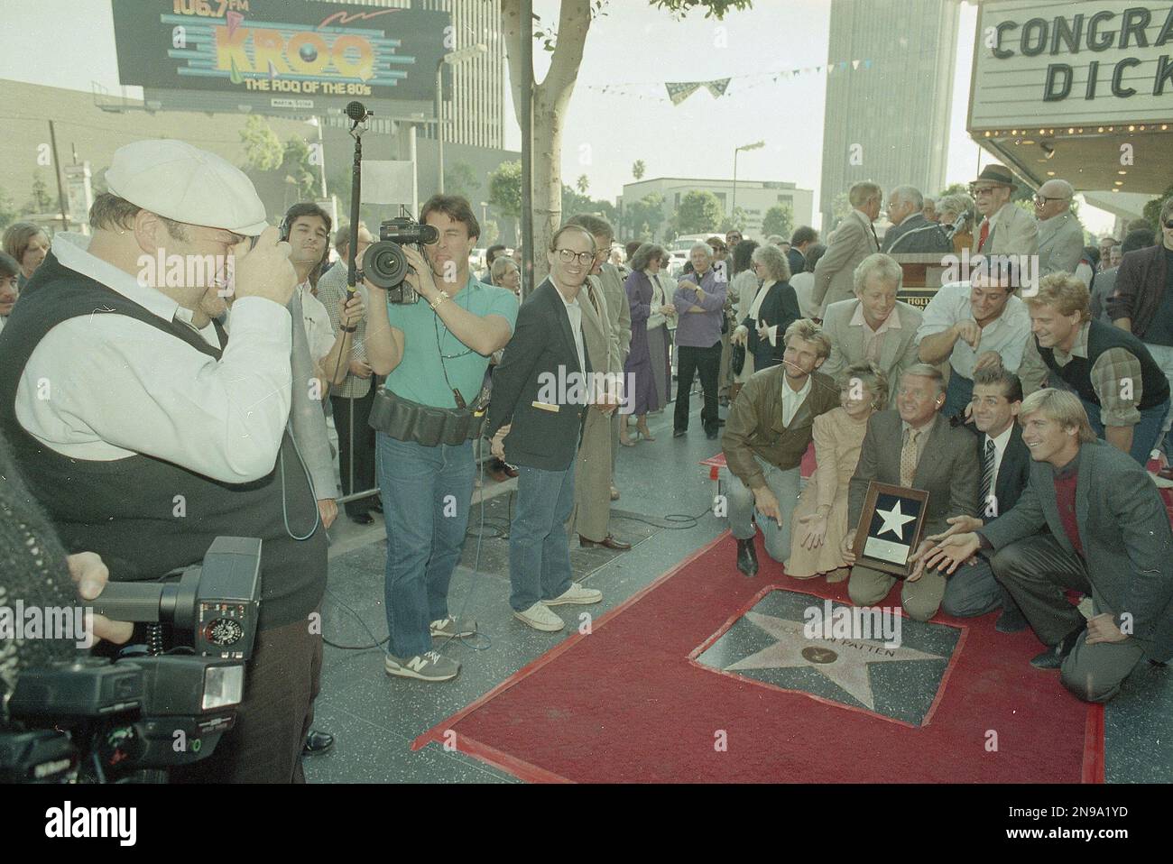 Comedian Dom DeLuise photographs actor Dick Van Patten and his family ...