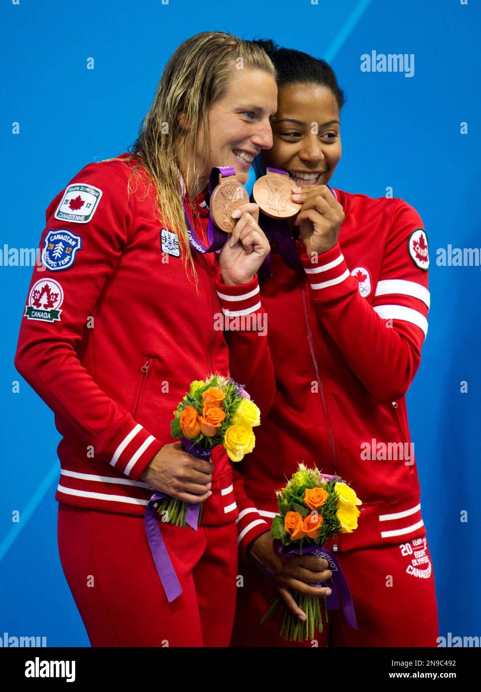 Canada's Emilie Heymans and Jennifer Abel celebrate their bronze medals ...